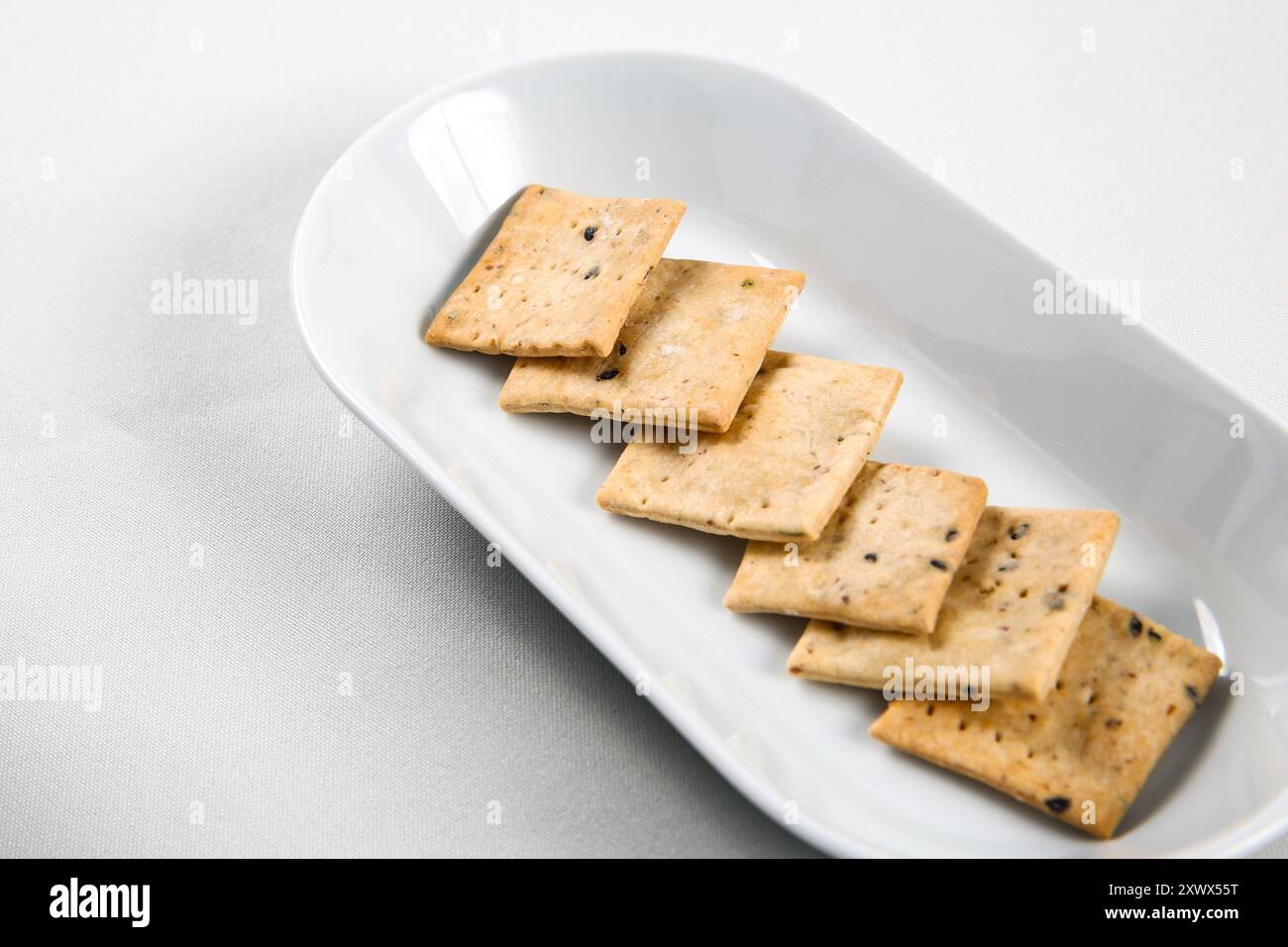 Square Cracker Biscuit With Vegetable Flavored And Crumbs From White ...