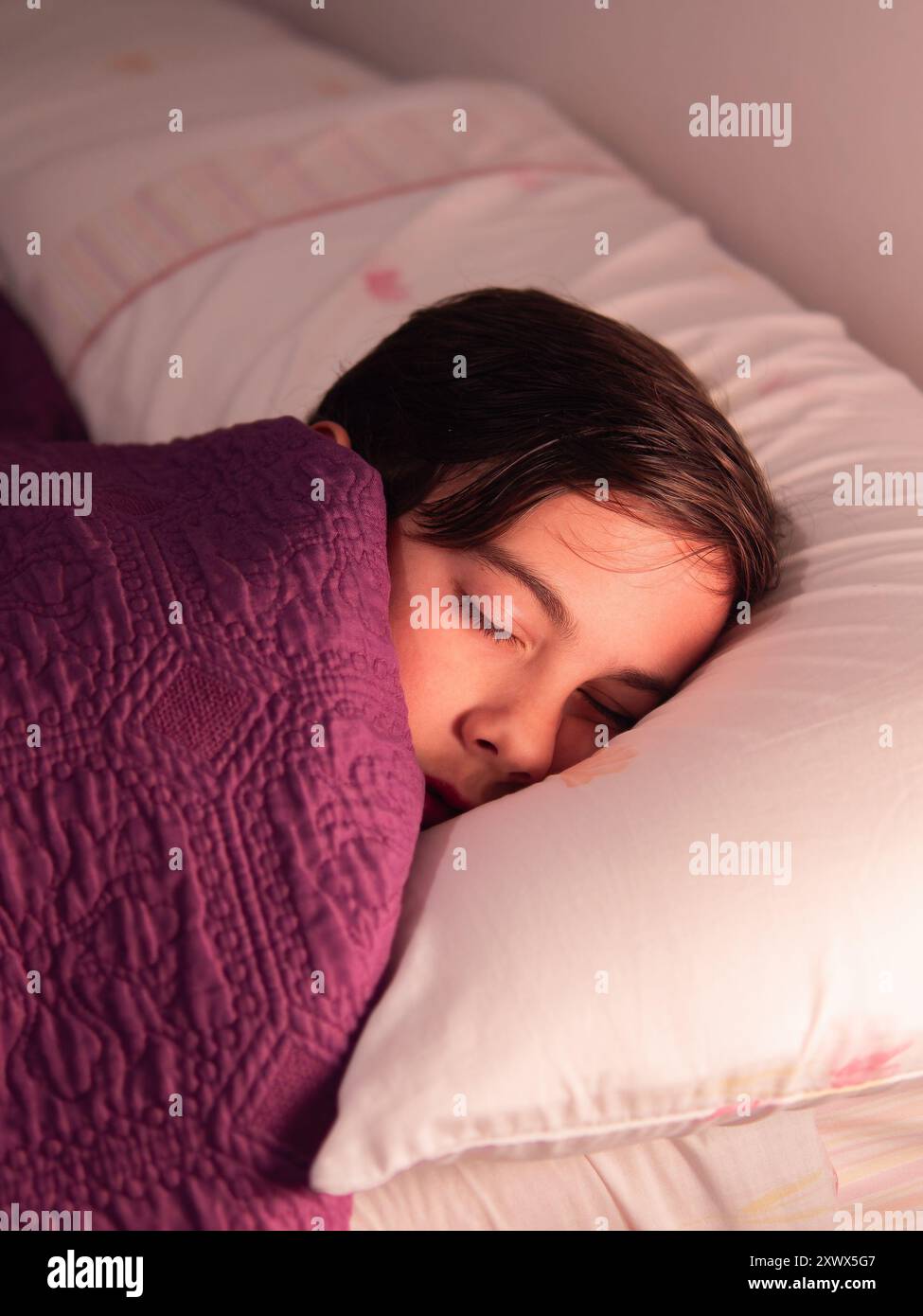 Child Sleeping in Bed with Soft Light Stock Photo - Alamy