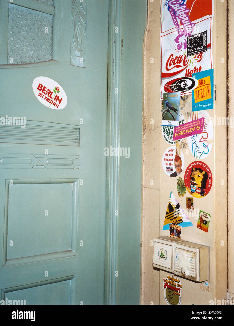 A collection of vintage stickers on a door in Berlin from 2005 ...