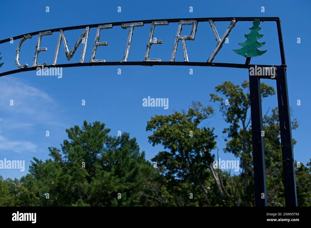 Metal letters spelling CEMETERY in a graveyard entrance Stock Photo - Alamy