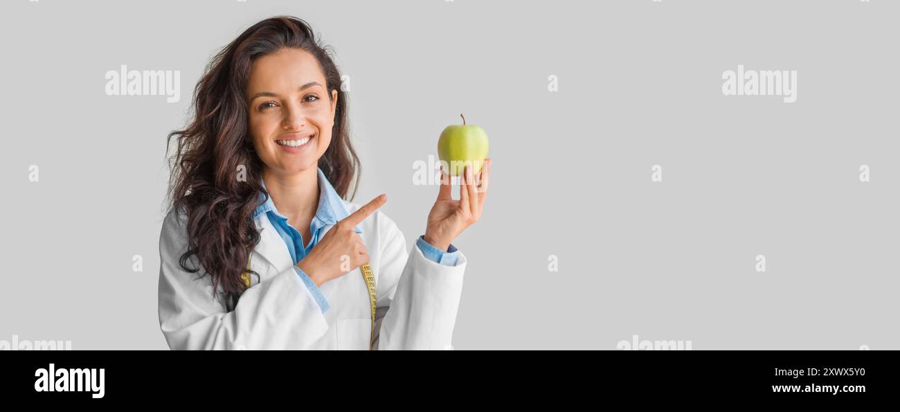 Health Professional Holding Green Apple While Smiling in Laboratory ...