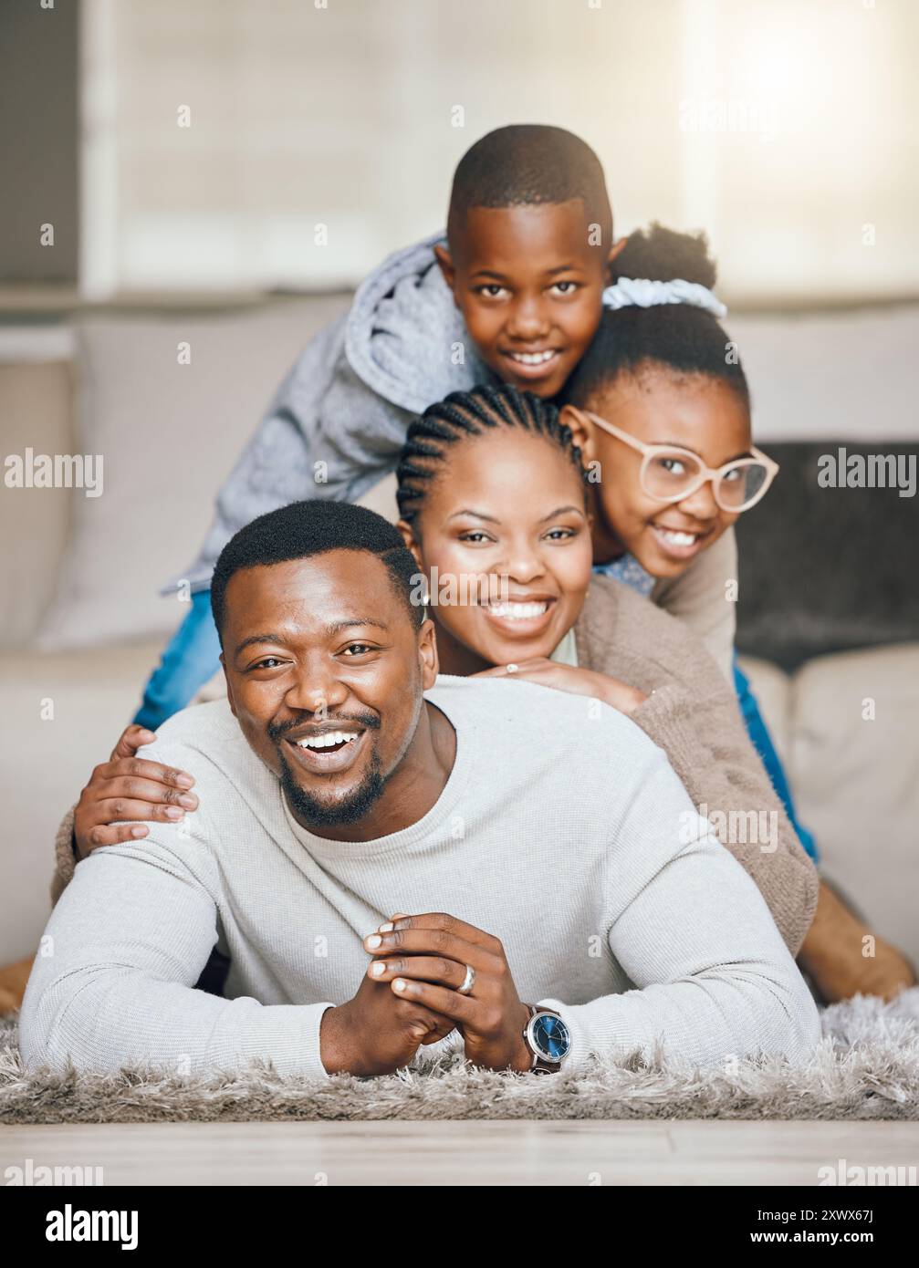 Portrait, black family and relax on floor at house for bonding, trust ...