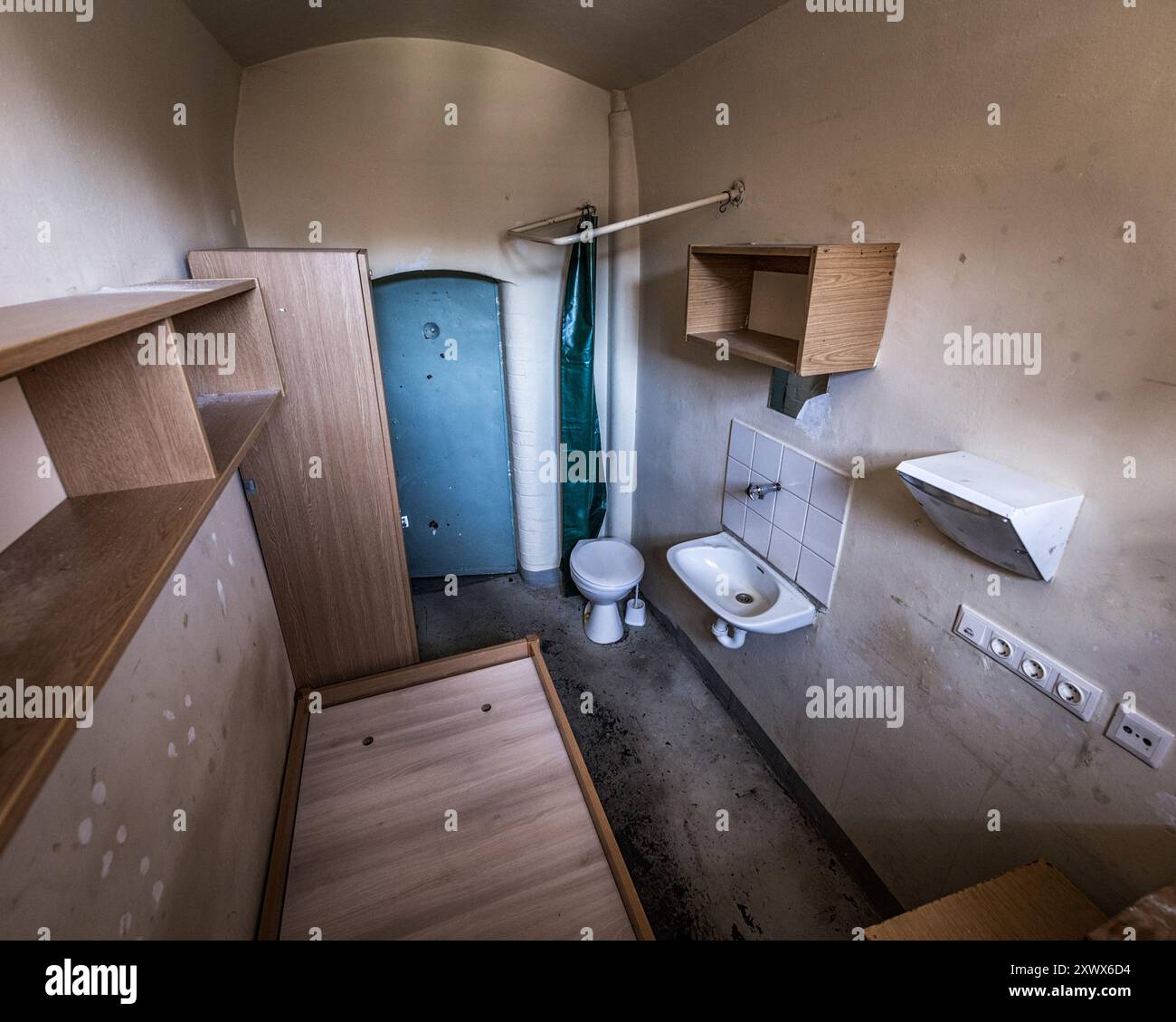A stark, empty prison cell located within Tegel Correctional Facility ...