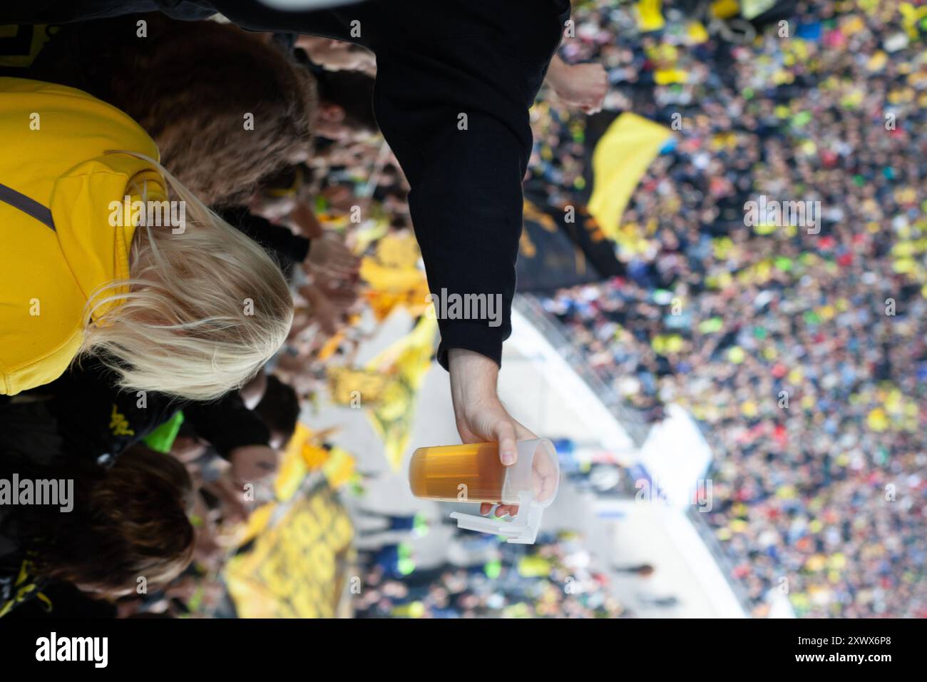 A vibrant photo of Borussia Dortmund fans at the Niedersachsenstadion ...