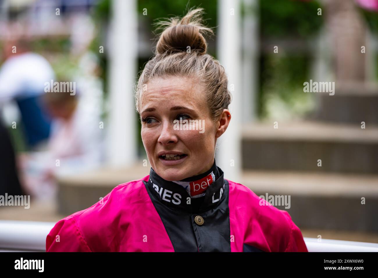Racing presenter Luca Viscogliosi interviews jockey Joanna Mason at ...