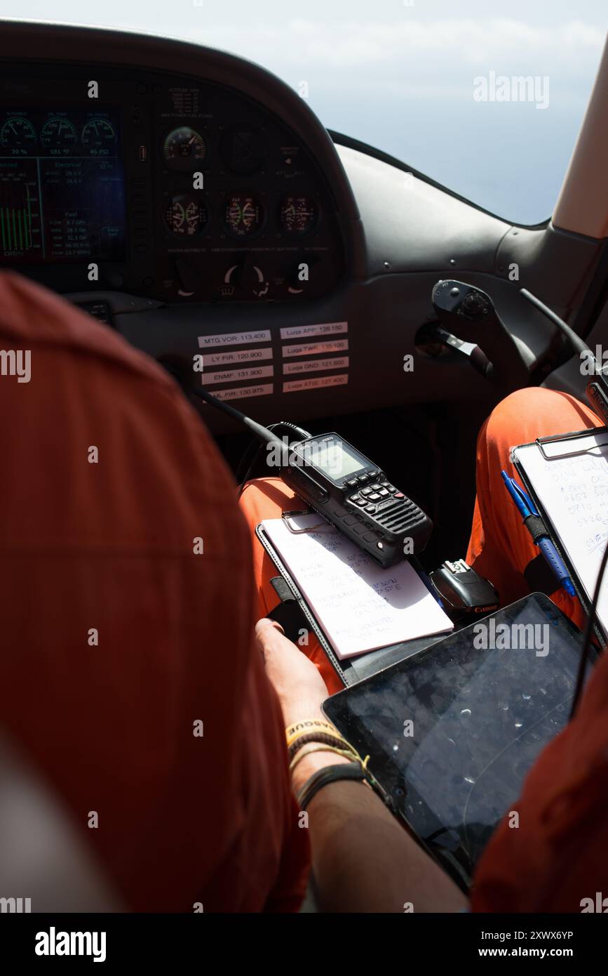 Inside view of the cockpit during an aerial search and rescue mission ...