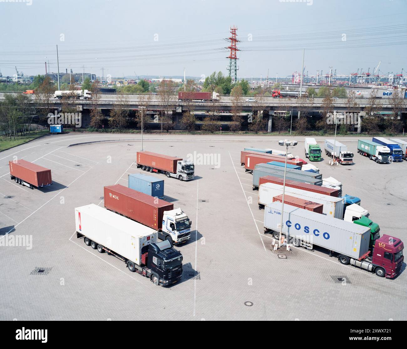 An overhead view of trucks parked with shipping containers at ...