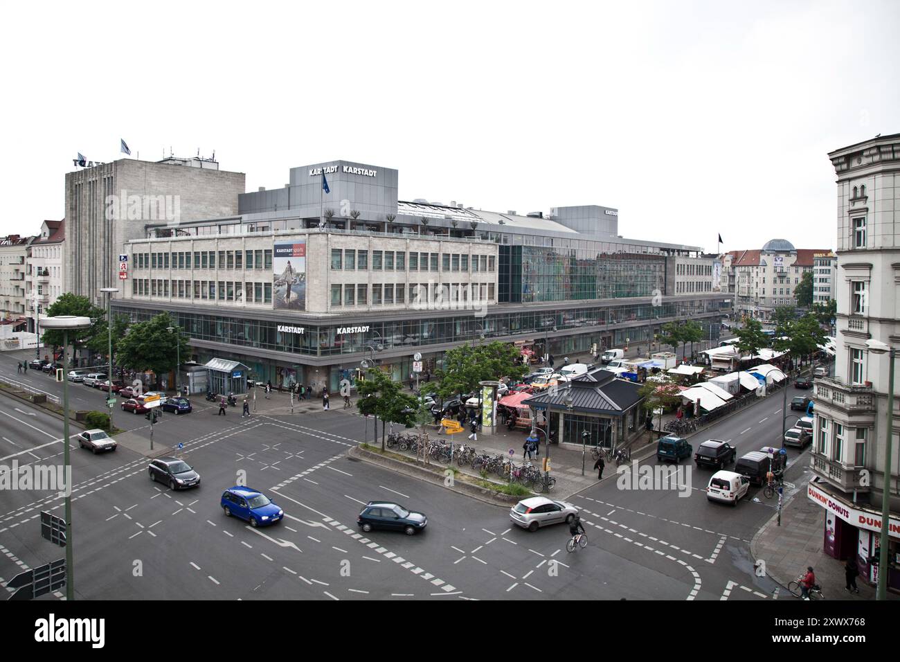 A vibrant scene of the iconic Karstadt department store at Hermannplatz ...
