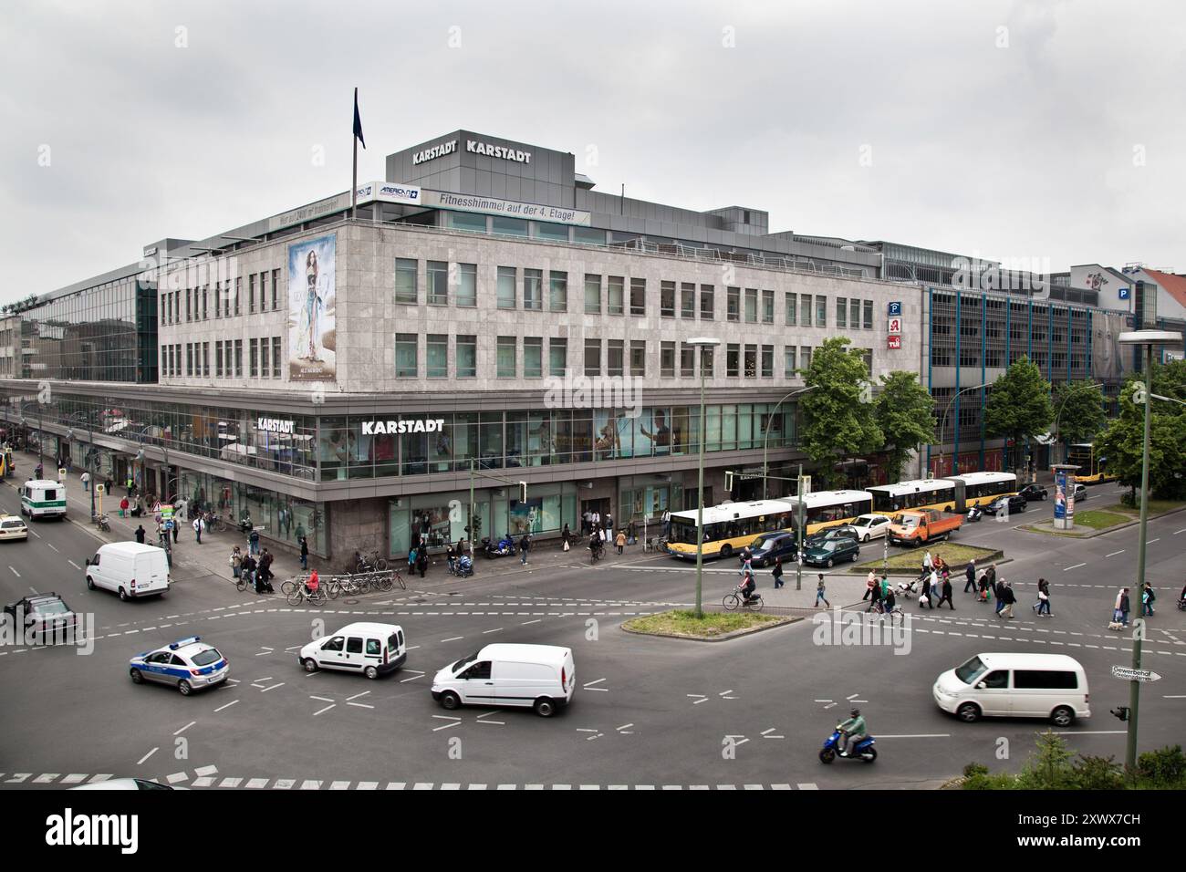 A bustling urban scene in front of the Karstadt department store at ...