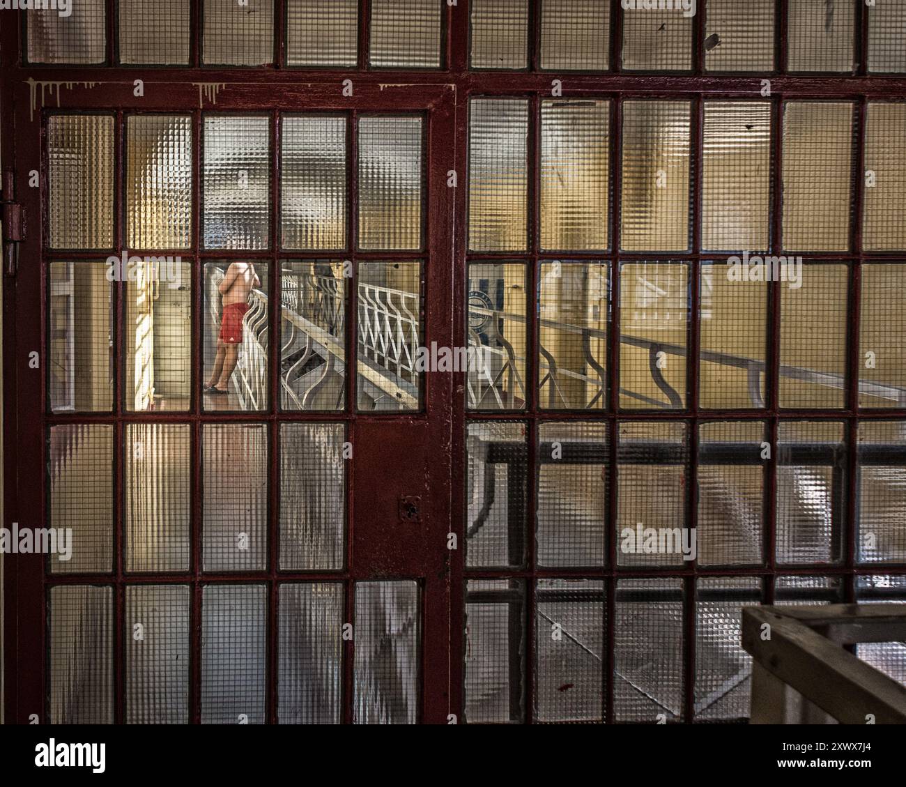 A solitary inmate stands inside the historic Tegel Prison in Berlin ...