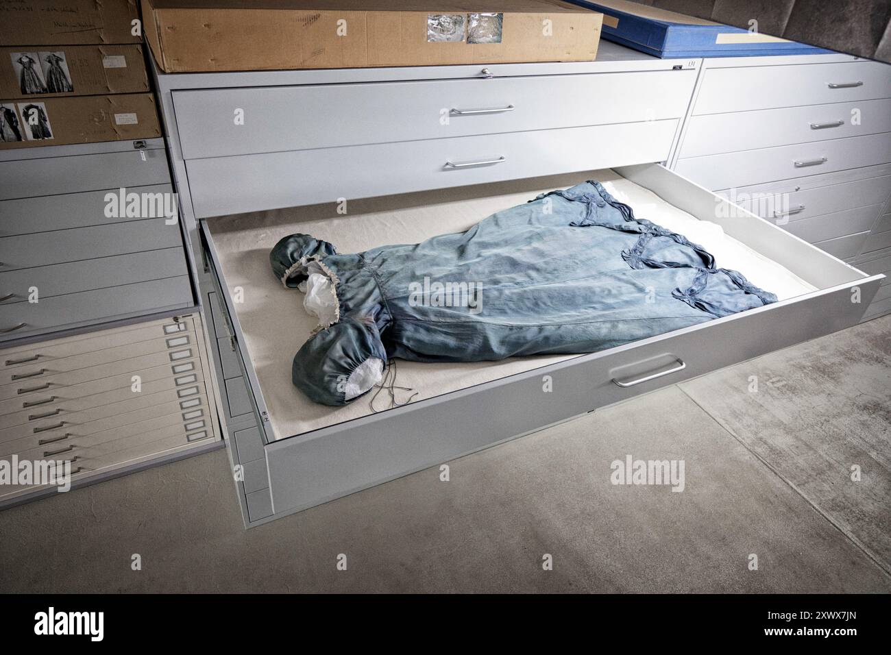 A historic dress belonging to Queen Louise is carefully preserved in ...