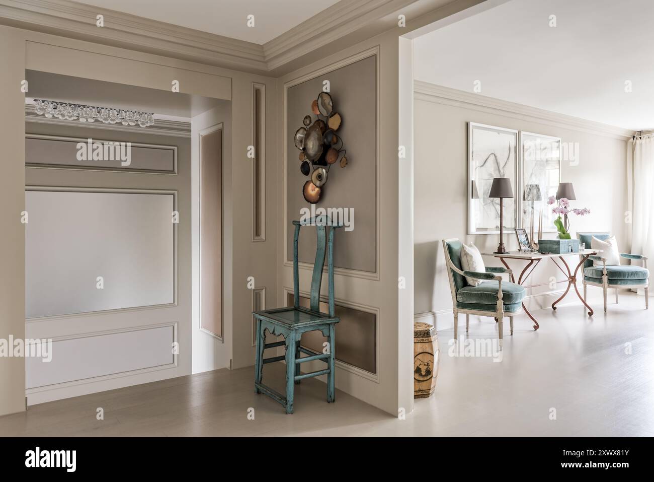Painted vintage chair in split level hallway with view to living room ...