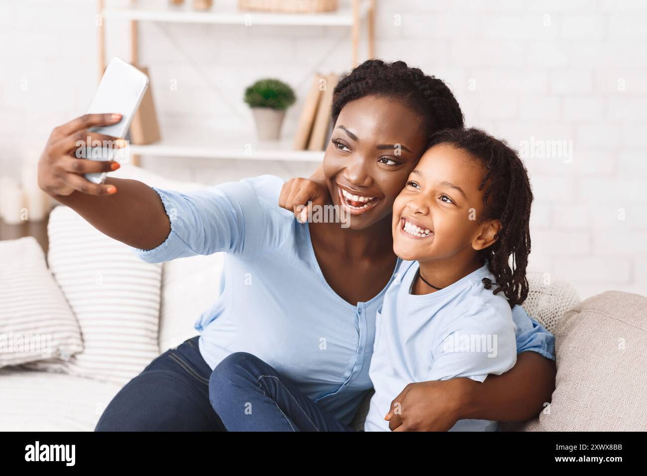 Happy black mom and daughter taking selfie Stock Photo - Alamy