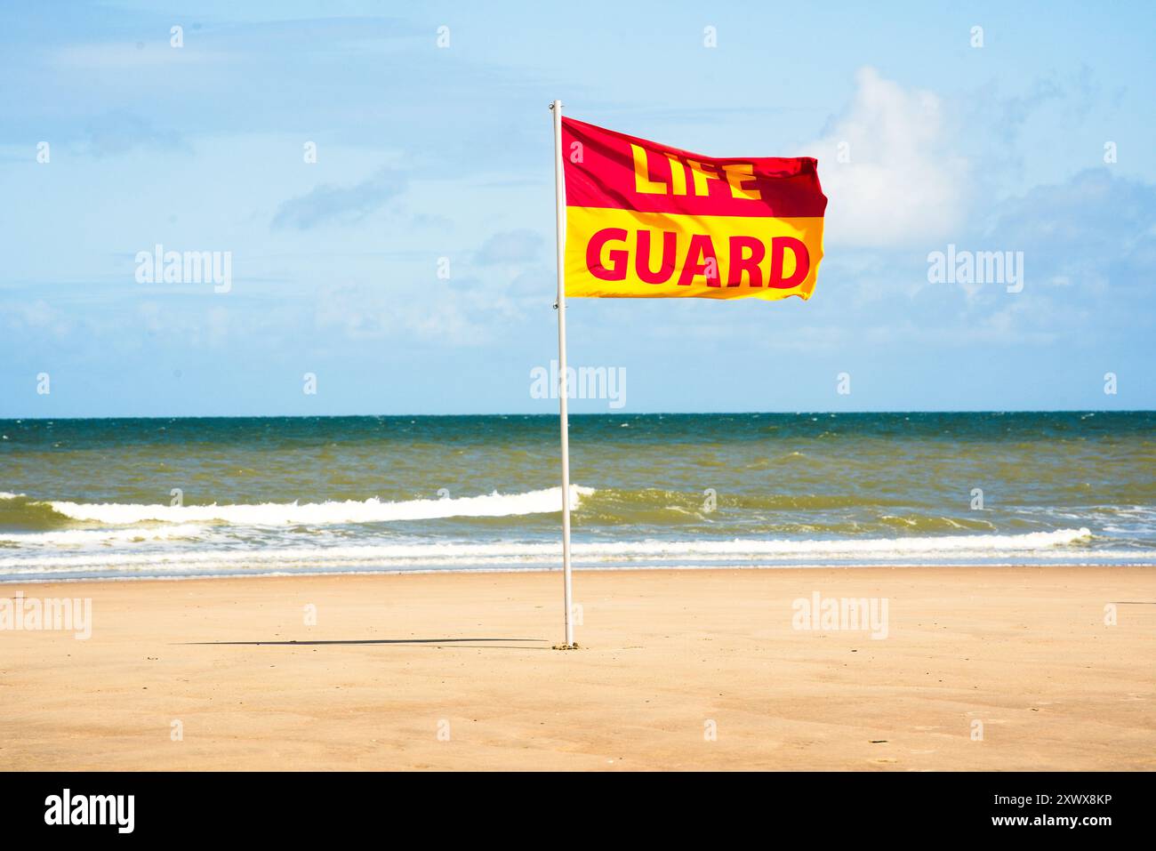 Safety at the Shore: Lifeguard Flag on the Sandy Beach 2 Stock Photo ...
