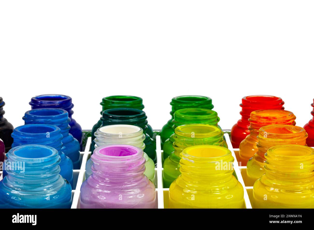 A vibrant display of various colored ink bottles arranged in a grid ...