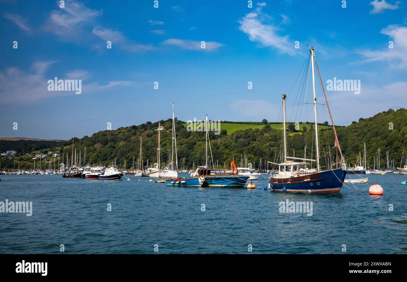 Yachts and pleasure boats moored next to rolling hills in the River ...