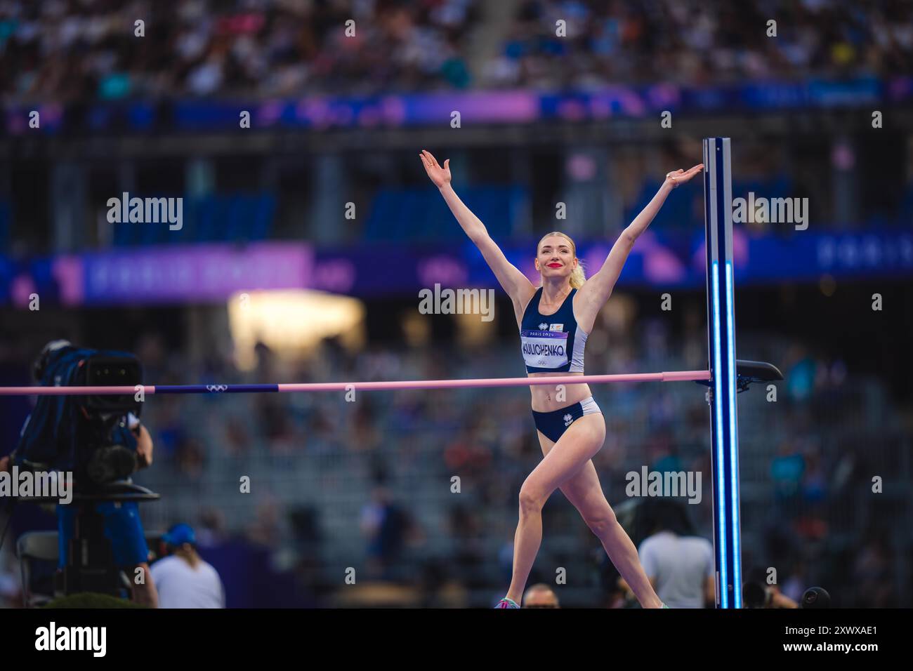Elena Kulichenko participating in the high jump at the Paris 2024 ...