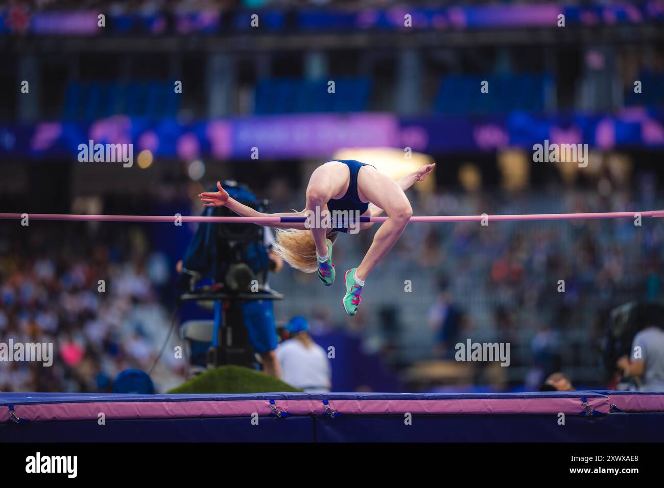 Elena Kulichenko participating in the high jump at the Paris 2024 ...