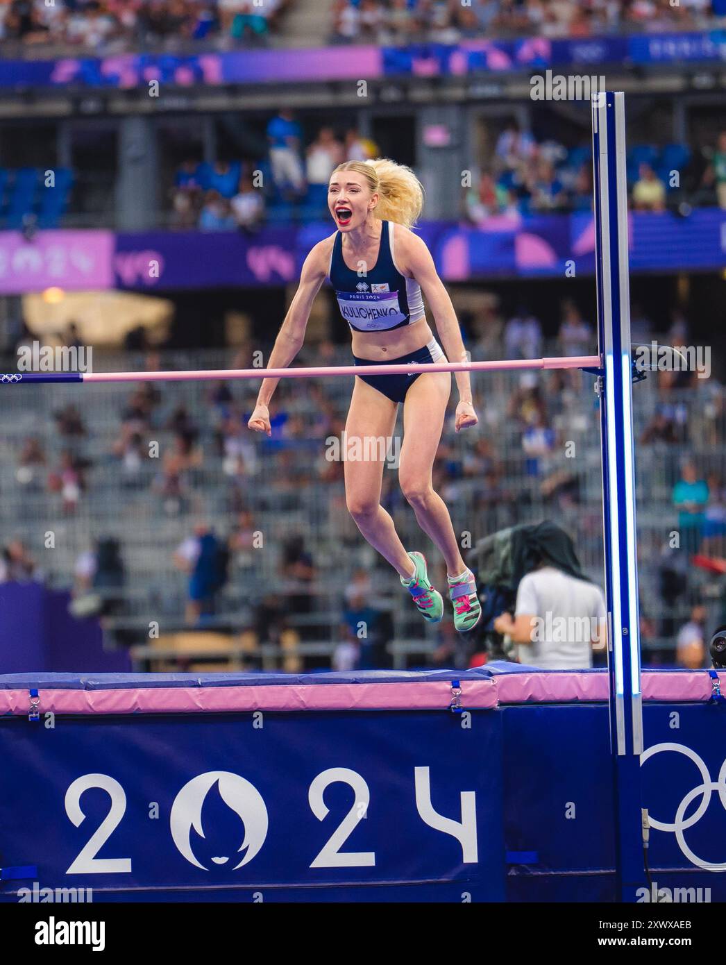 Elena Kulichenko participating in the high jump at the Paris 2024 ...