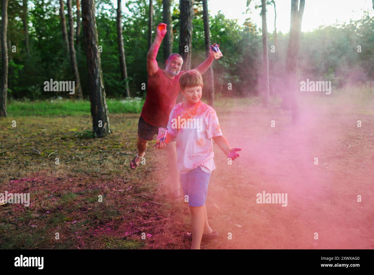 Father and son at Holi paint party. Family make funny party Stock Photo ...