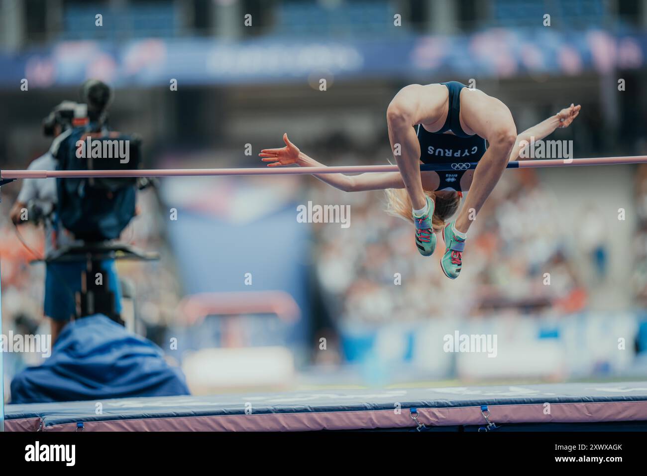 Elena Kulichenko participating in the high jump at the Paris 2024 ...