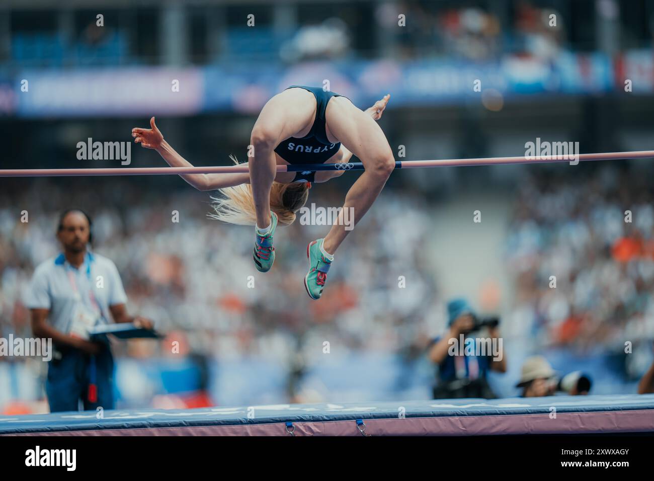 Elena Kulichenko participating in the high jump at the Paris 2024 ...