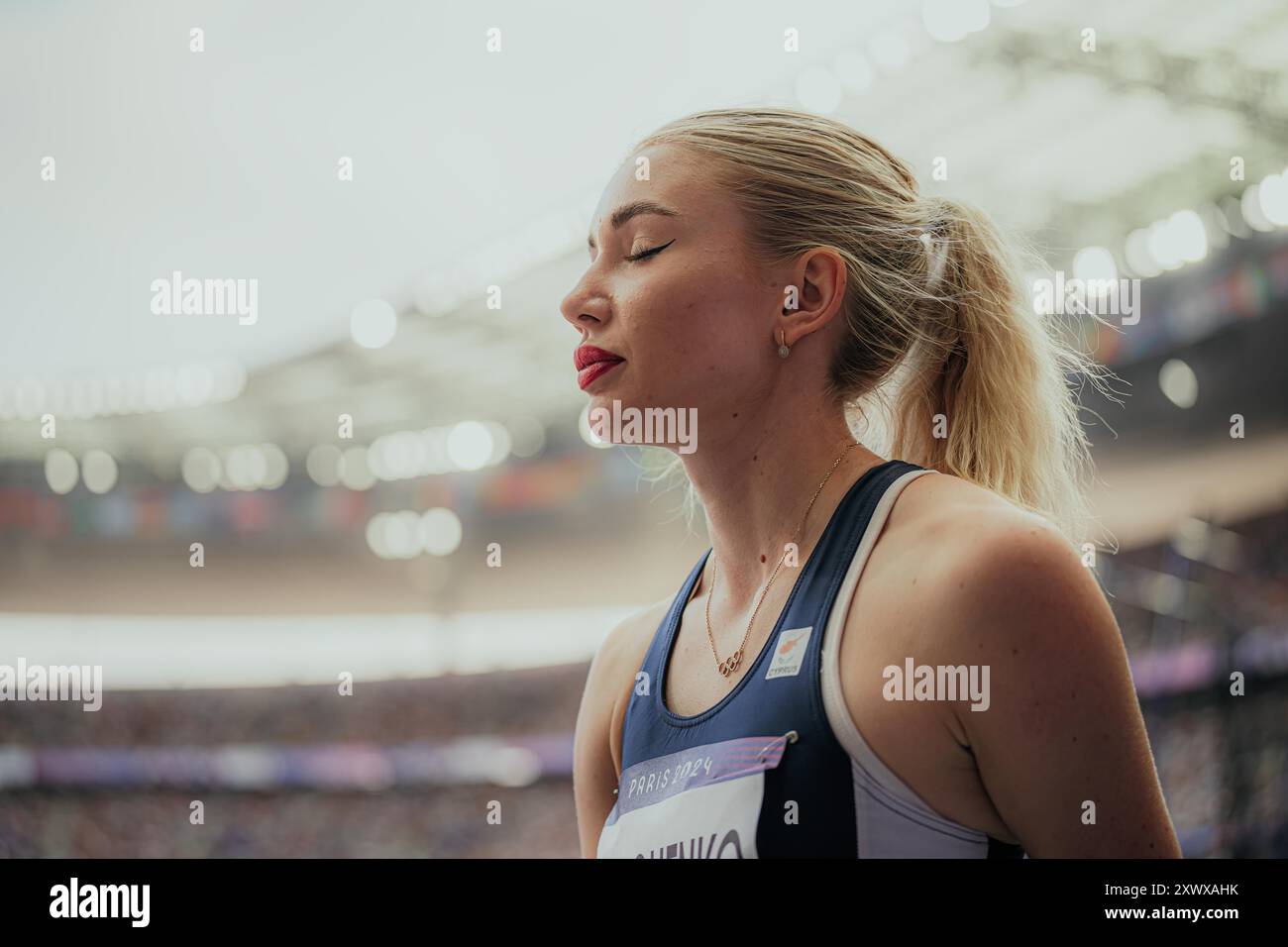 Elena Kulichenko participating in the high jump at the Paris 2024 ...