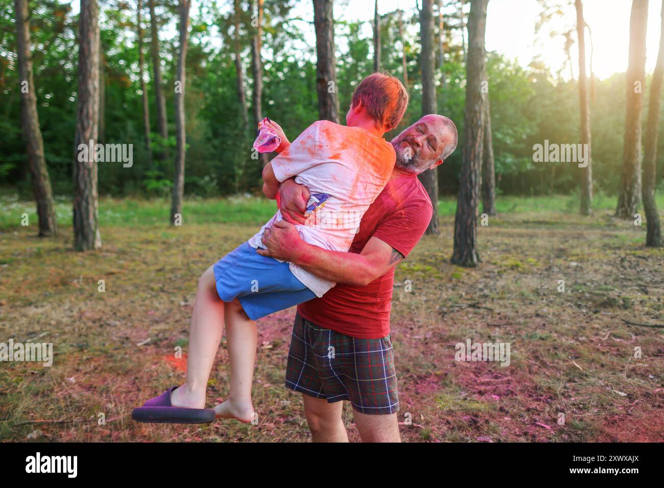 Father and son at Holi paint party. Family make funny party Stock Photo ...