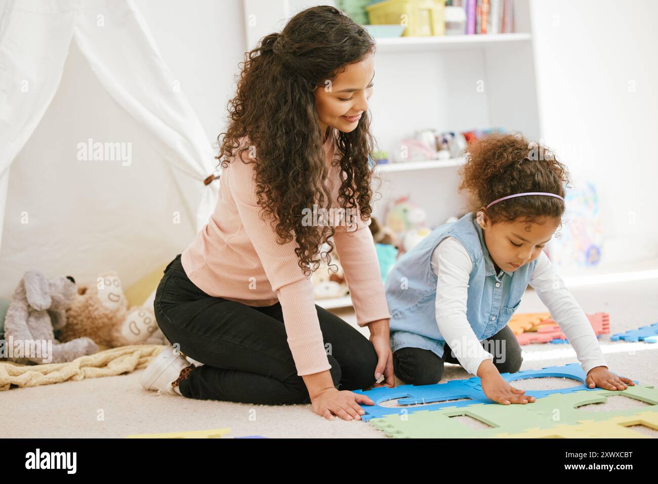Mother, girl and toys in home for learning on floor, kindergarten ...