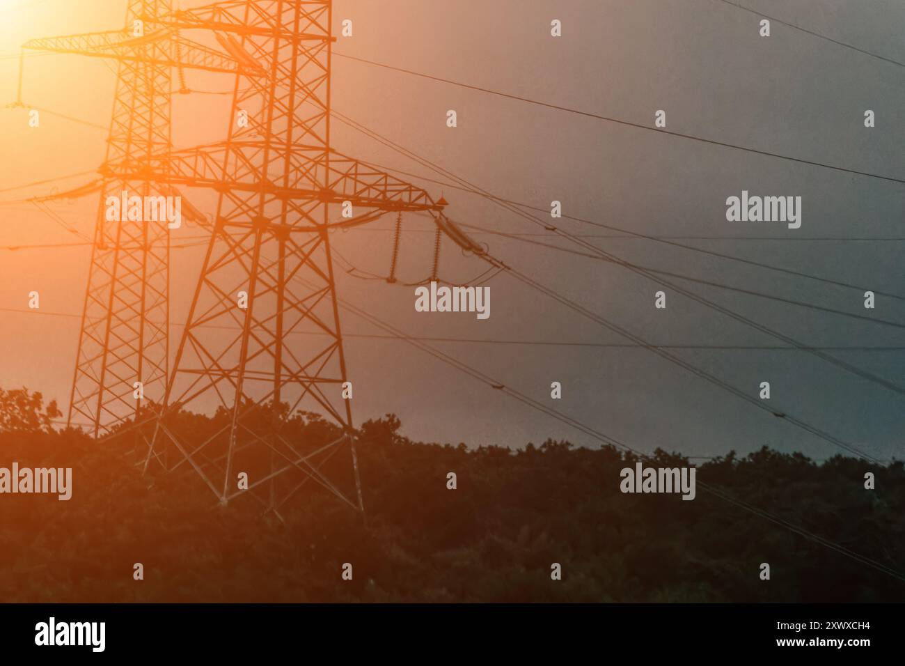 High voltage electric distribution network at sunset. Power ...