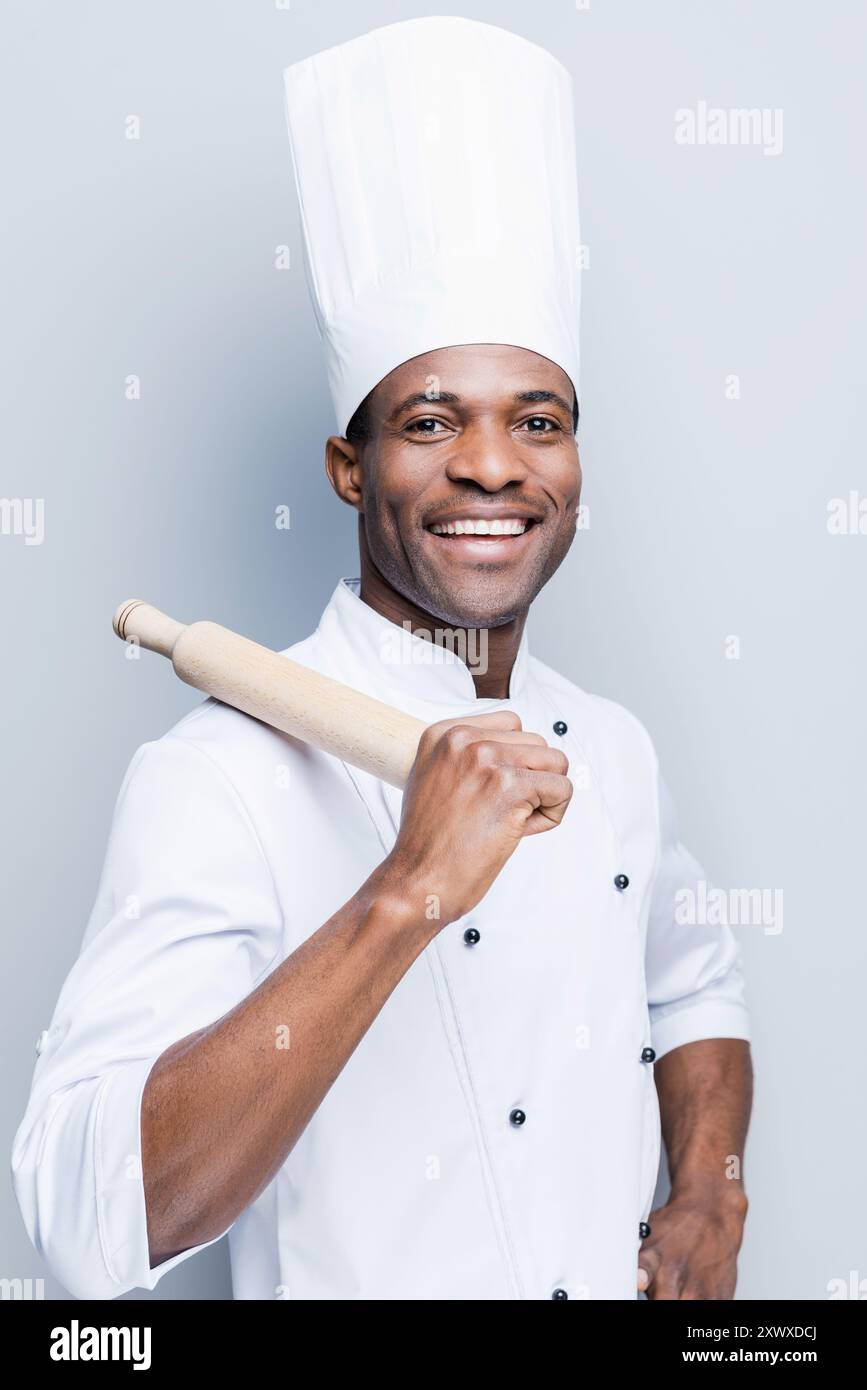 He is a champion in the kitchen. Cheerful young African chef in white ...