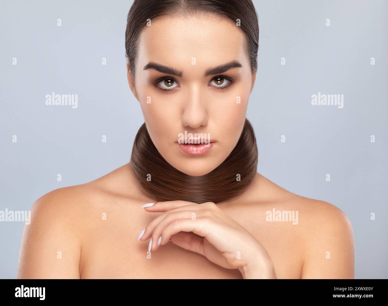 Portrait of a beautiful girl with makeup and healthy clean skin. She ...