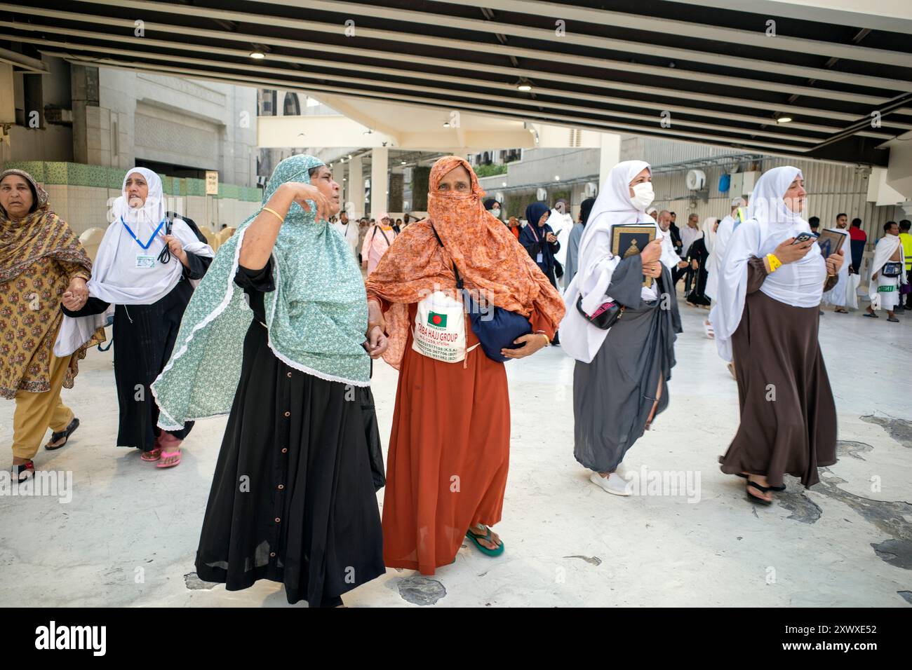 Mecca, Saudi Arabia - June 5, 2024: Women Hajj and Umrah pilgrim from Bangladesh walking with ...