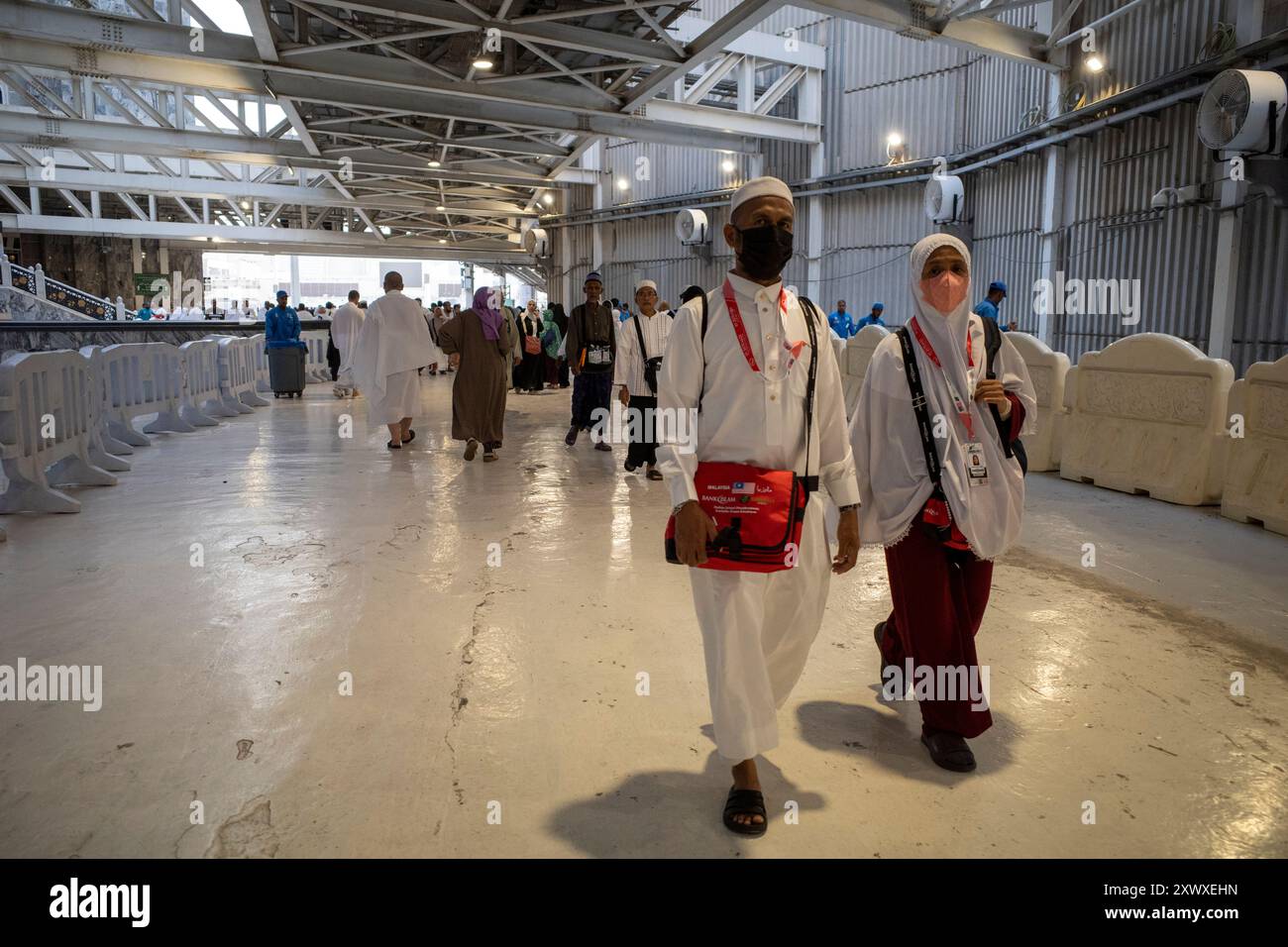 Mecca, Saudi Arabia - June 5, 2024: Hajj and Umrah pilgrim from Malaysia, walking near Masjidil ...