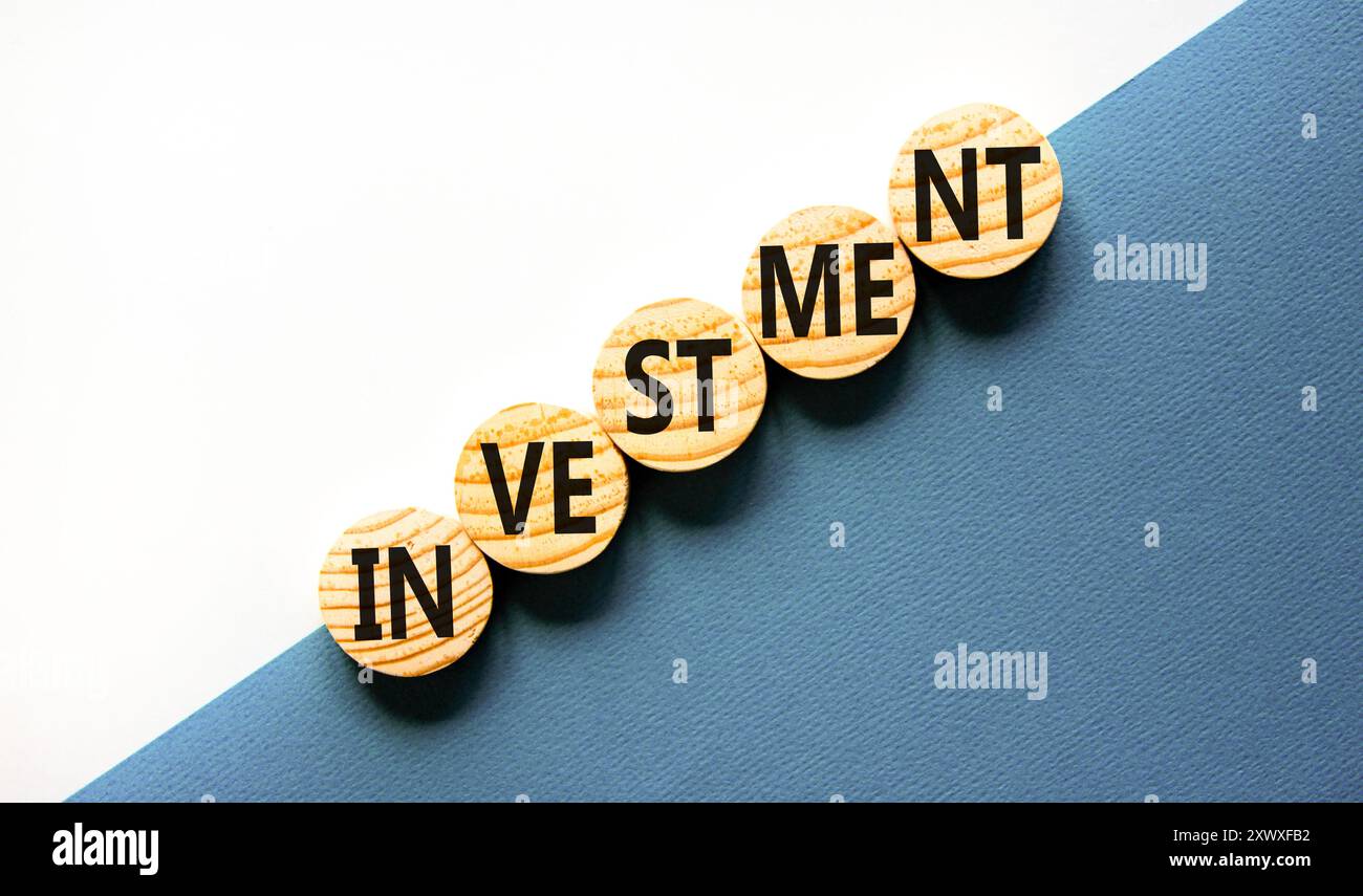 Investment symbol. Concept word Investment on beautiful wooden circles ...