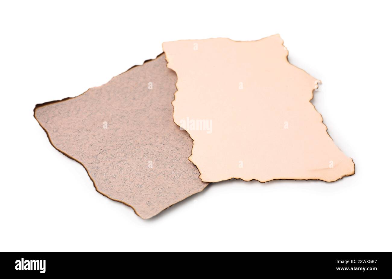 Pieces of old paper with dark burnt borders isolated on white Stock ...