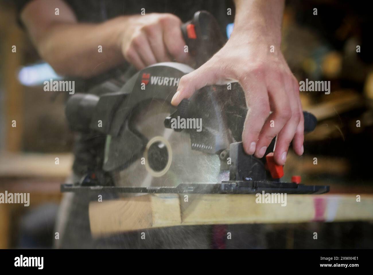 A man cuts wood with a circular saw. Berlin, August 14, 2024 Stock ...