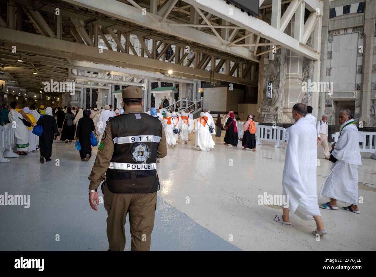 Mecca, Saudi Arabia - June 5, 2024: Saudi Arabia Police walking near the Al Haram Mosque, Makkah ...
