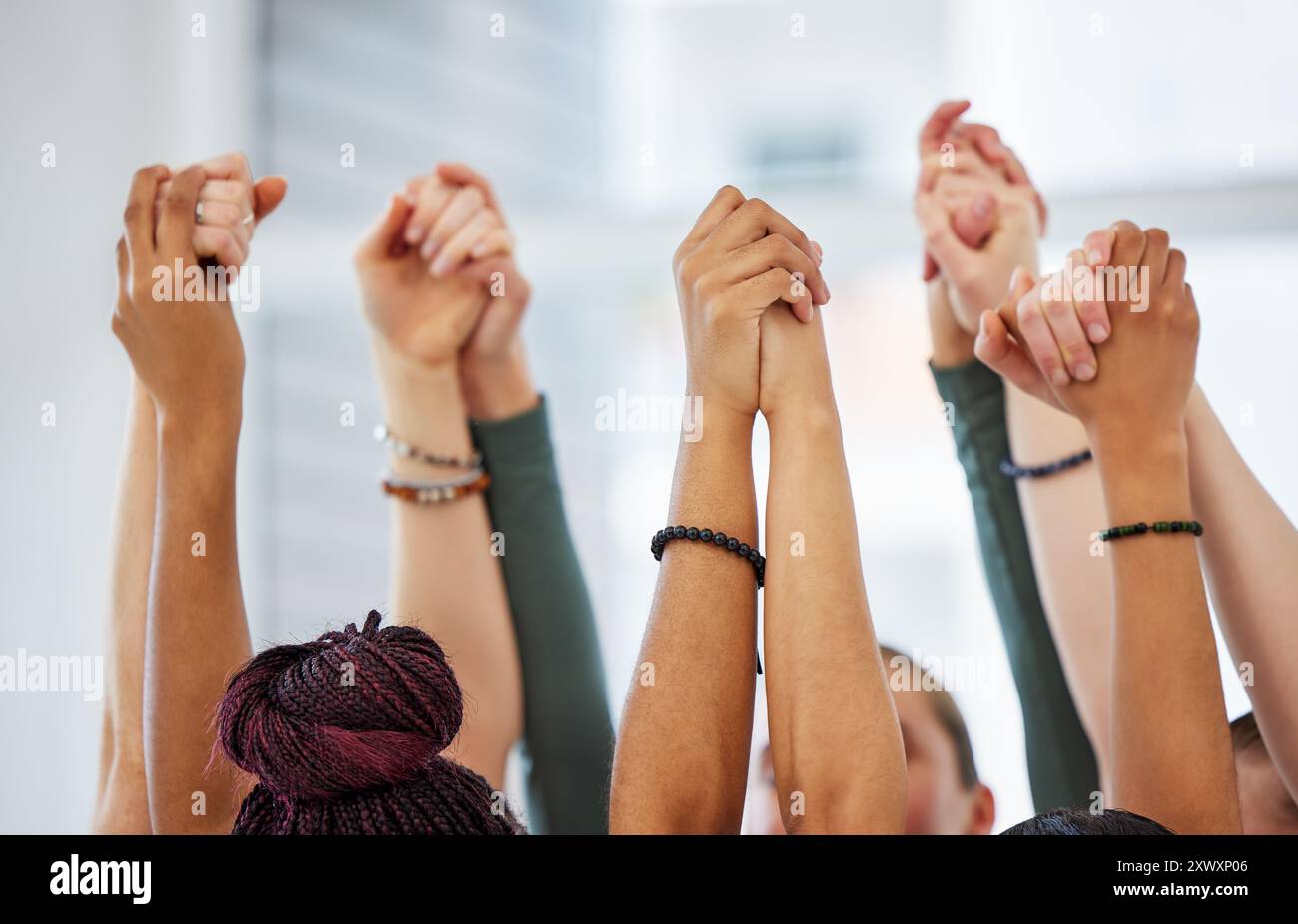 Fitness, group and people with hands raised in unity for workout ...