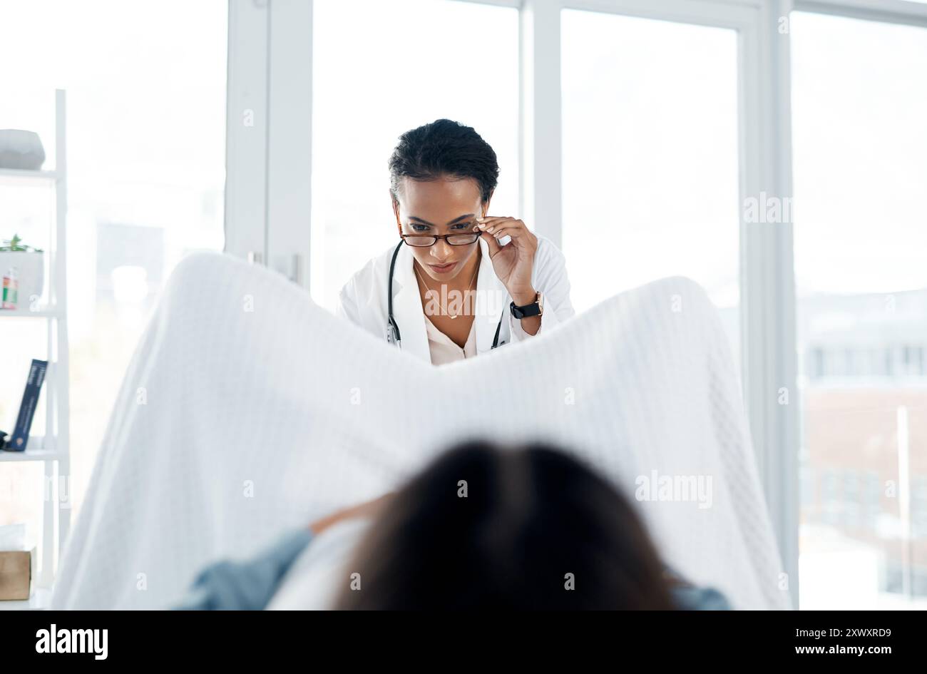 Gynecology, doctor and woman with checkup at clinic for pelvic exam ...