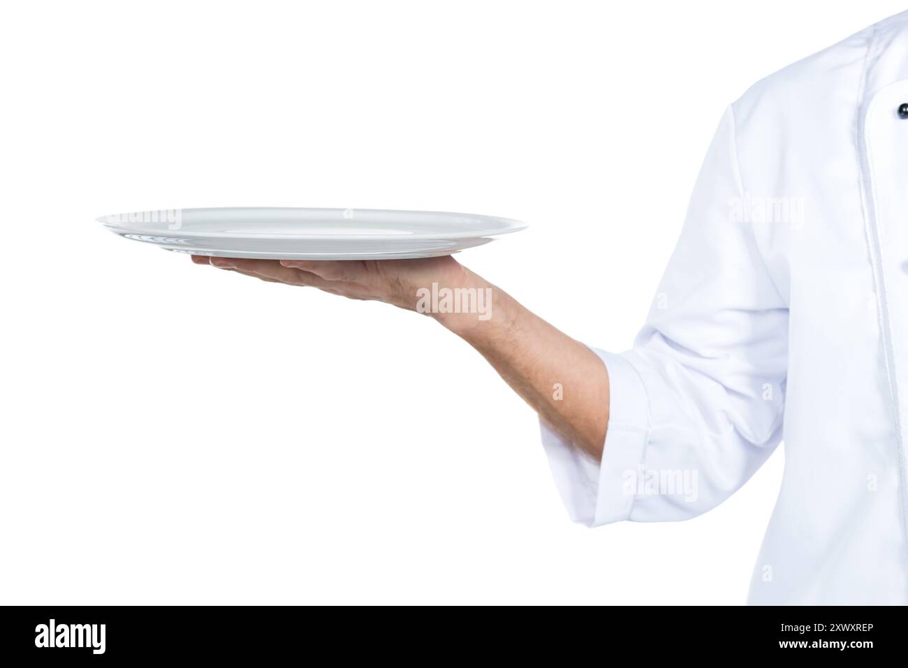 Chef with plate. Close-up of chef in white uniform holding empty plate ...