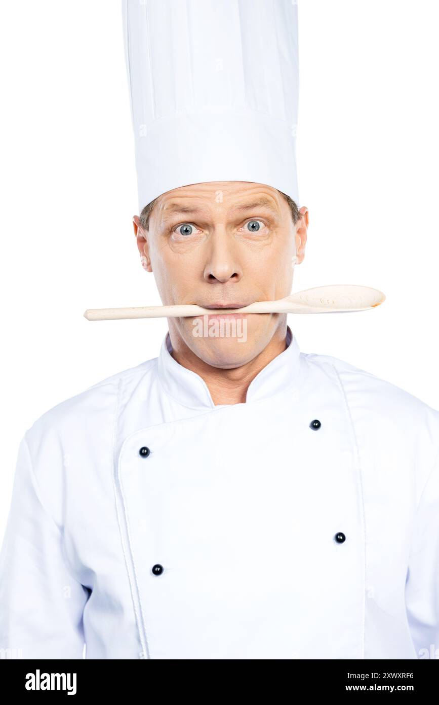 What to cook? Surprised mature chef in white uniform holding wooden ...