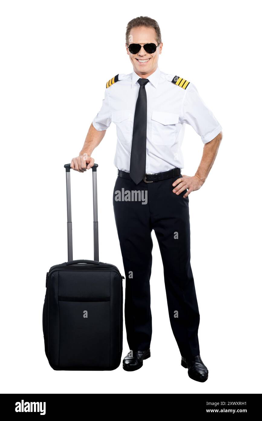 New day and new destination. Confident male pilot in uniform leaning ...