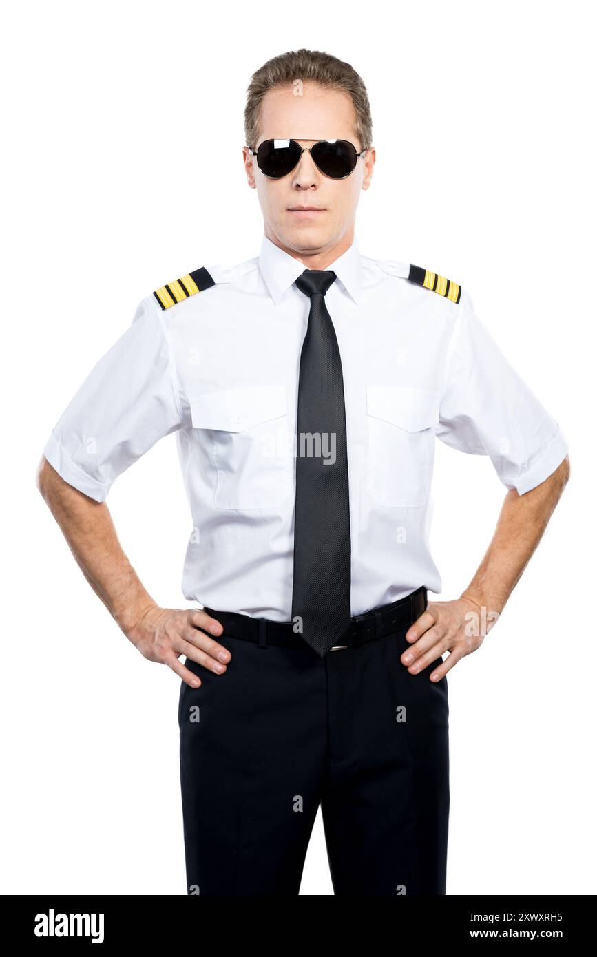 Confident and experienced pilot. Confident male pilot in uniform ...