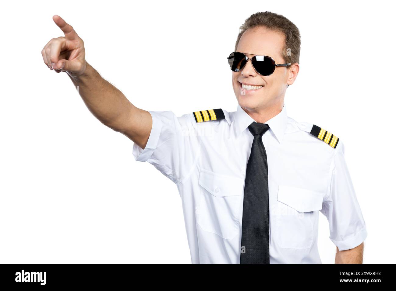 In love with sky. Confident male pilot in uniform pointing away and ...