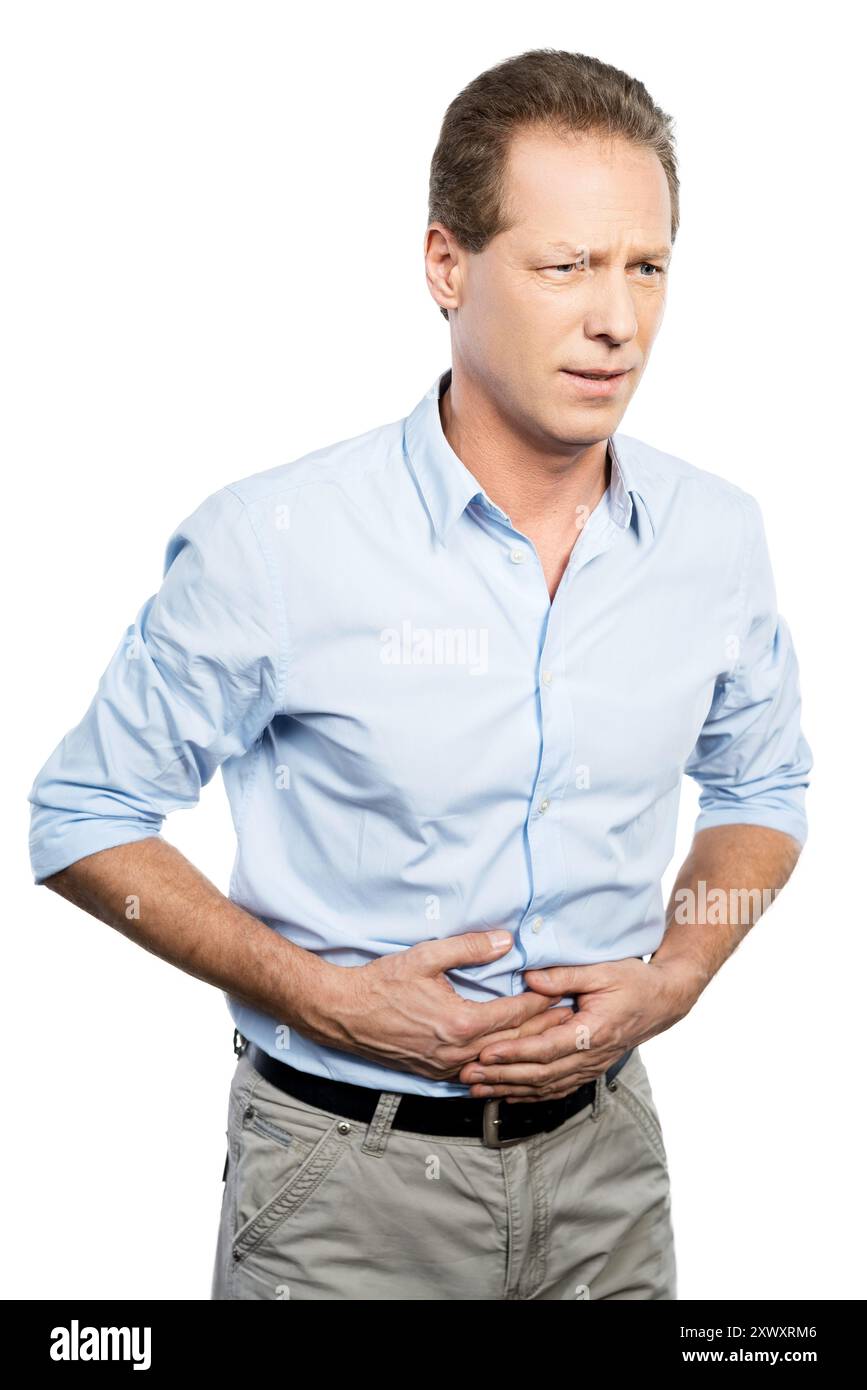 Awful stomachache. Frustrated mature man touching his stomach and ...