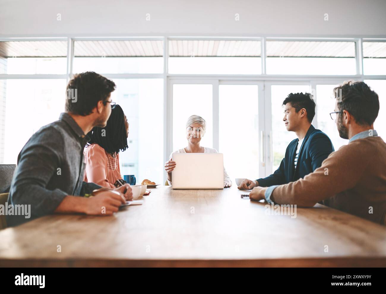 Laptop, meeting and boss with business people in office for discussion ...
