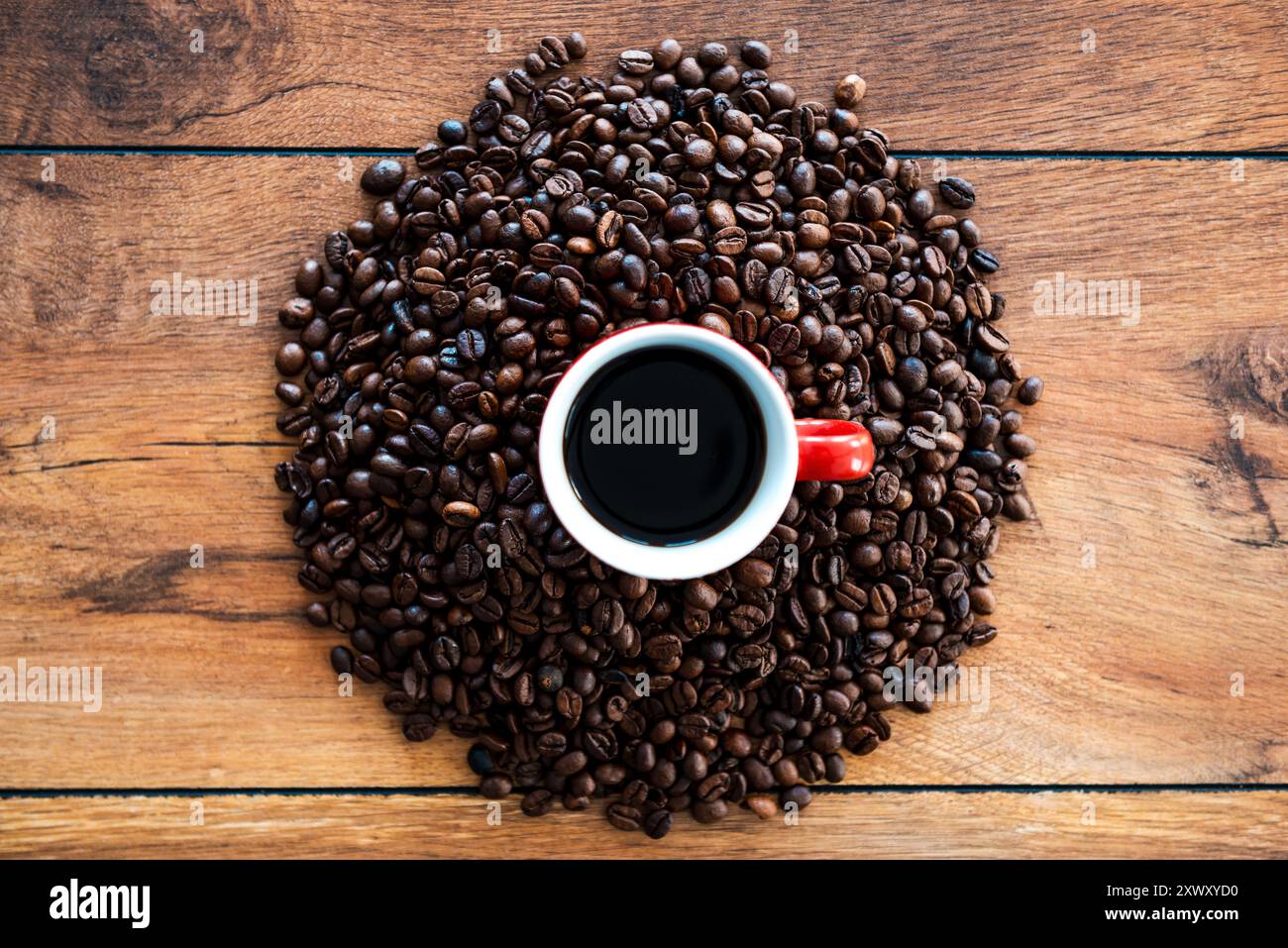 The freshest coffee. Top view of cup with fresh coffee laying on the ...