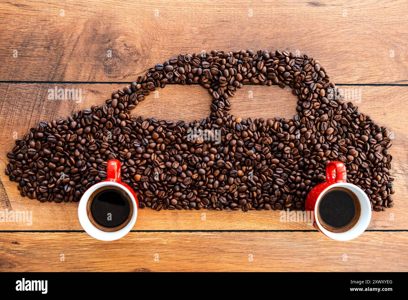 Coffee car. Top view of car made from coffee beans laying on the wooden ...