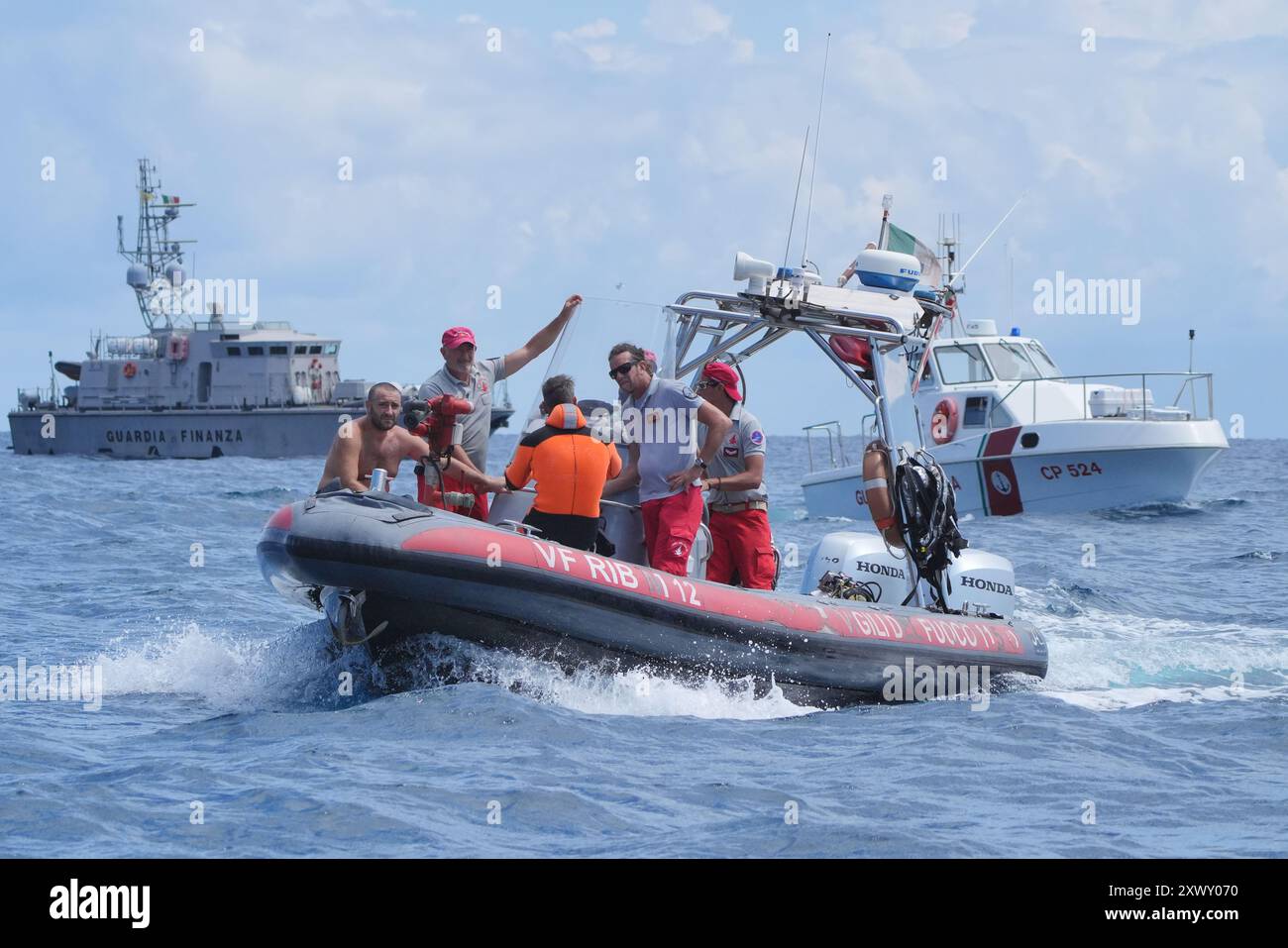 An Italian fire service diving crew return to Porticello Harbour from ...